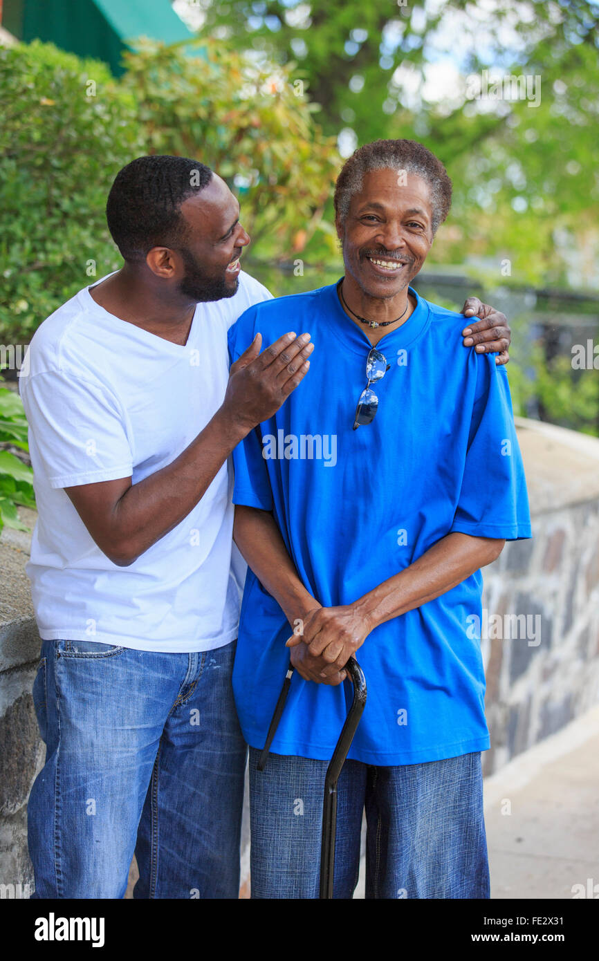 Man with Traumatic Brain Injury with cane enjoying his friend Stock ...