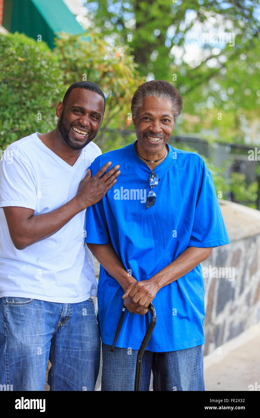 Man with Traumatic Brain Injury with cane enjoying his friend Stock ...