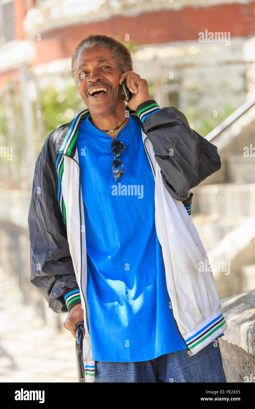 Man with Traumatic Brain Injury using his cell phone Stock Photo - Alamy