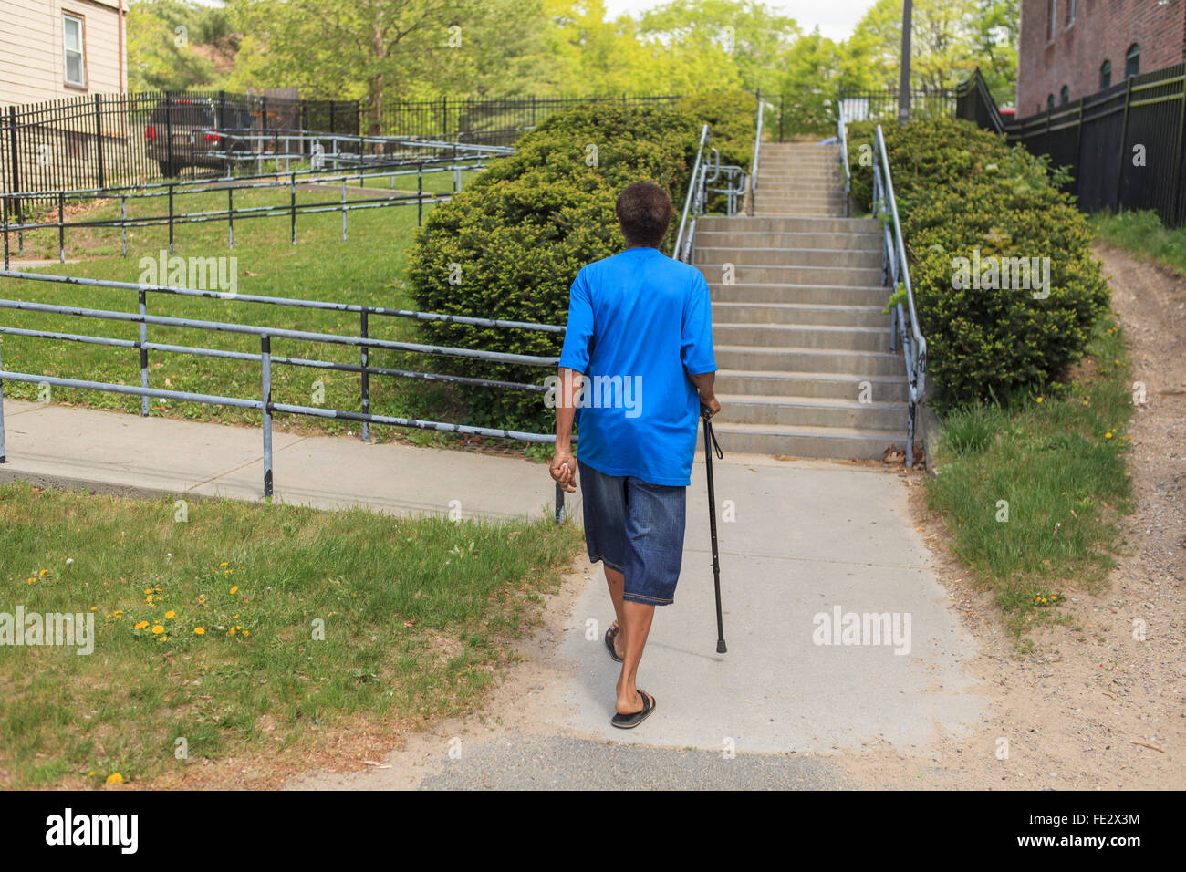 Man with Traumatic Brain Injury walking in his neighborhood Stock Photo ...