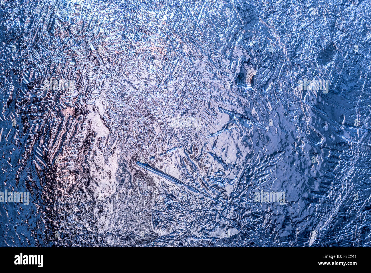 Through a transparent and melting layer of ice Stock Photo - Alamy