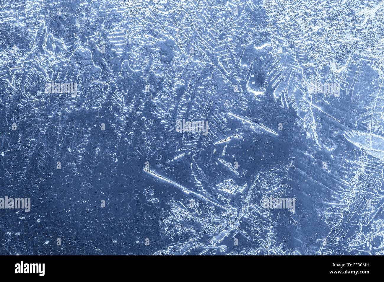 Through a transparent and melting layer of ice Stock Photo - Alamy