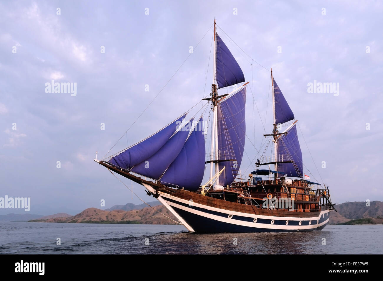 Sailboat with hoisted sails Stock Photo - Alamy