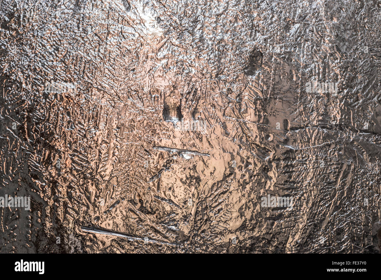 Through a transparent and melting layer of ice Stock Photo - Alamy