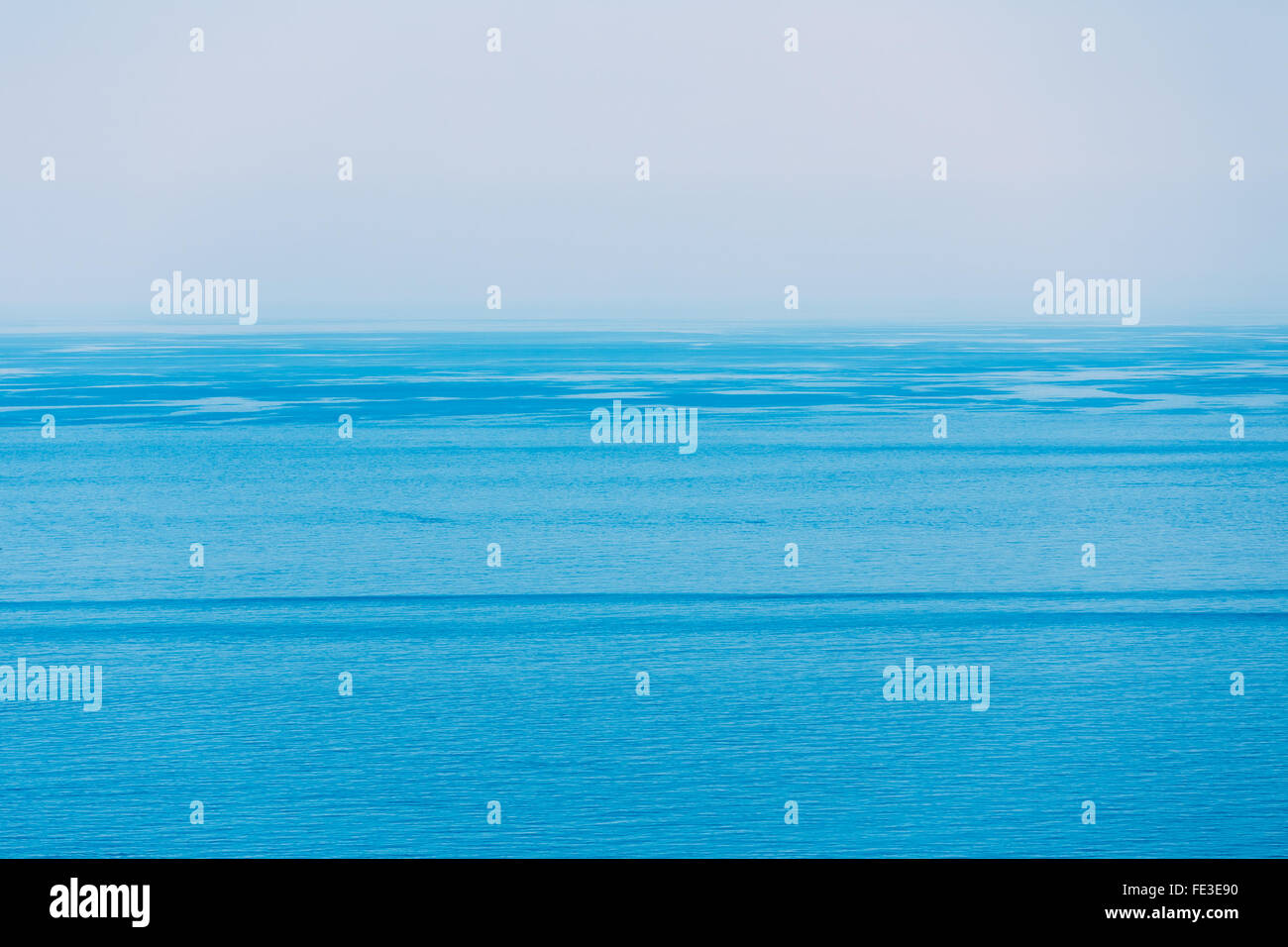 Calm Sea Ocean And Blue Clear Sky Background Stock Photo - Alamy