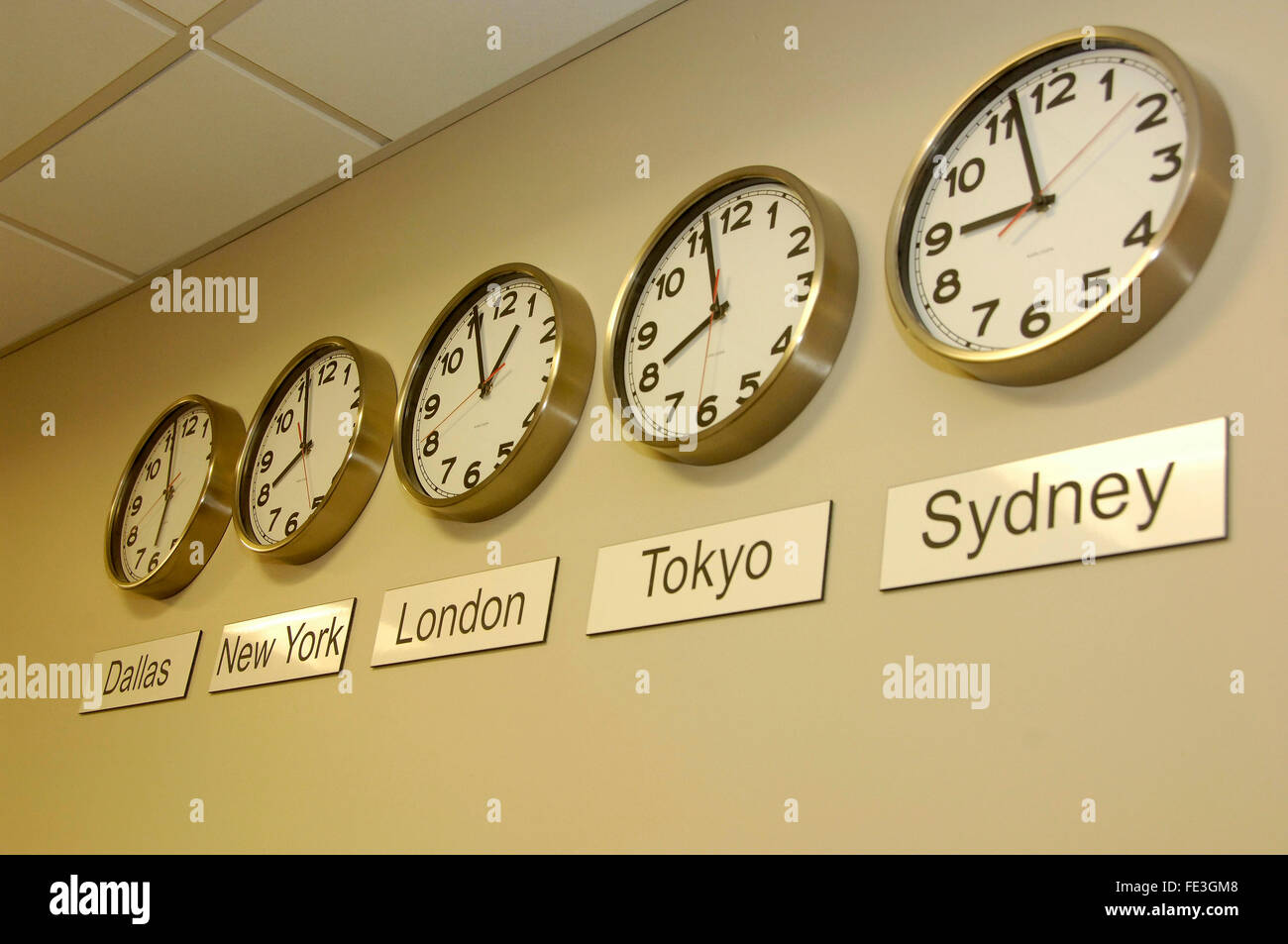 Clocks in a city office Stock Photo - Alamy
