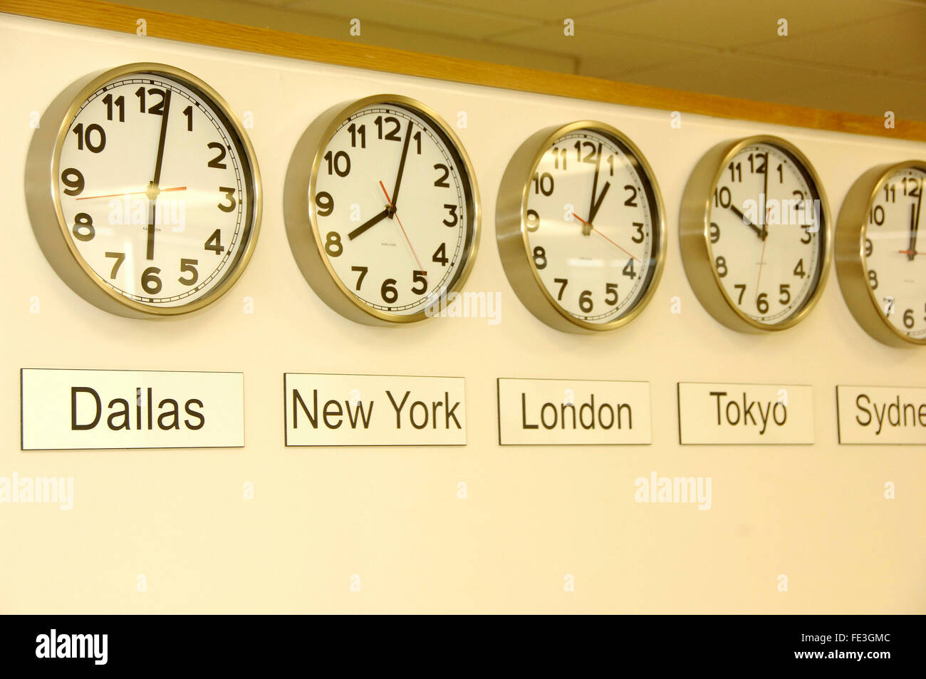 Clocks in a city office Stock Photo - Alamy