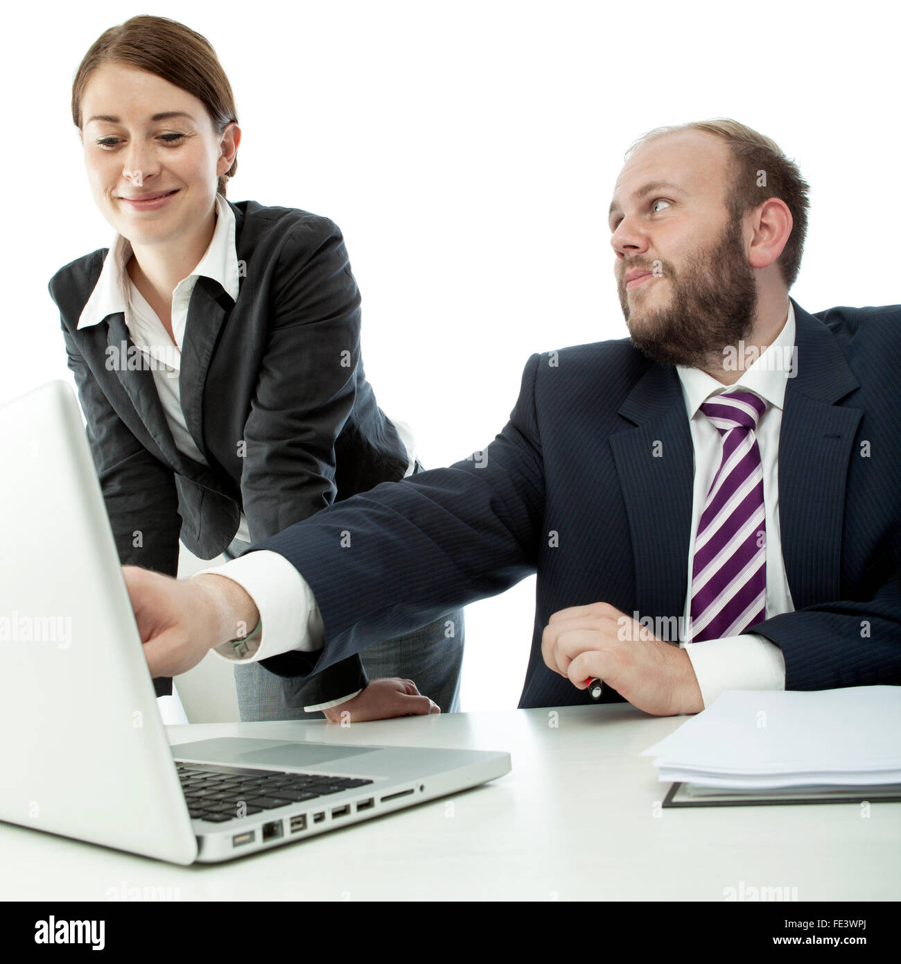 beard business man brunette woman at desk point at laptop Stock Photo ...