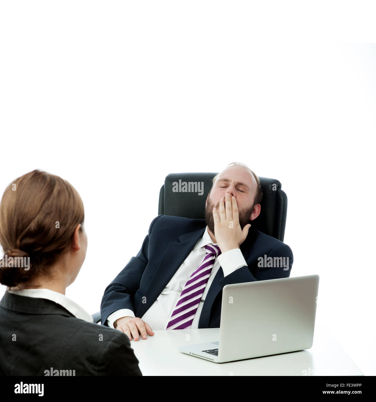 beard business man brunette woman desk yawn Stock Photo - Alamy