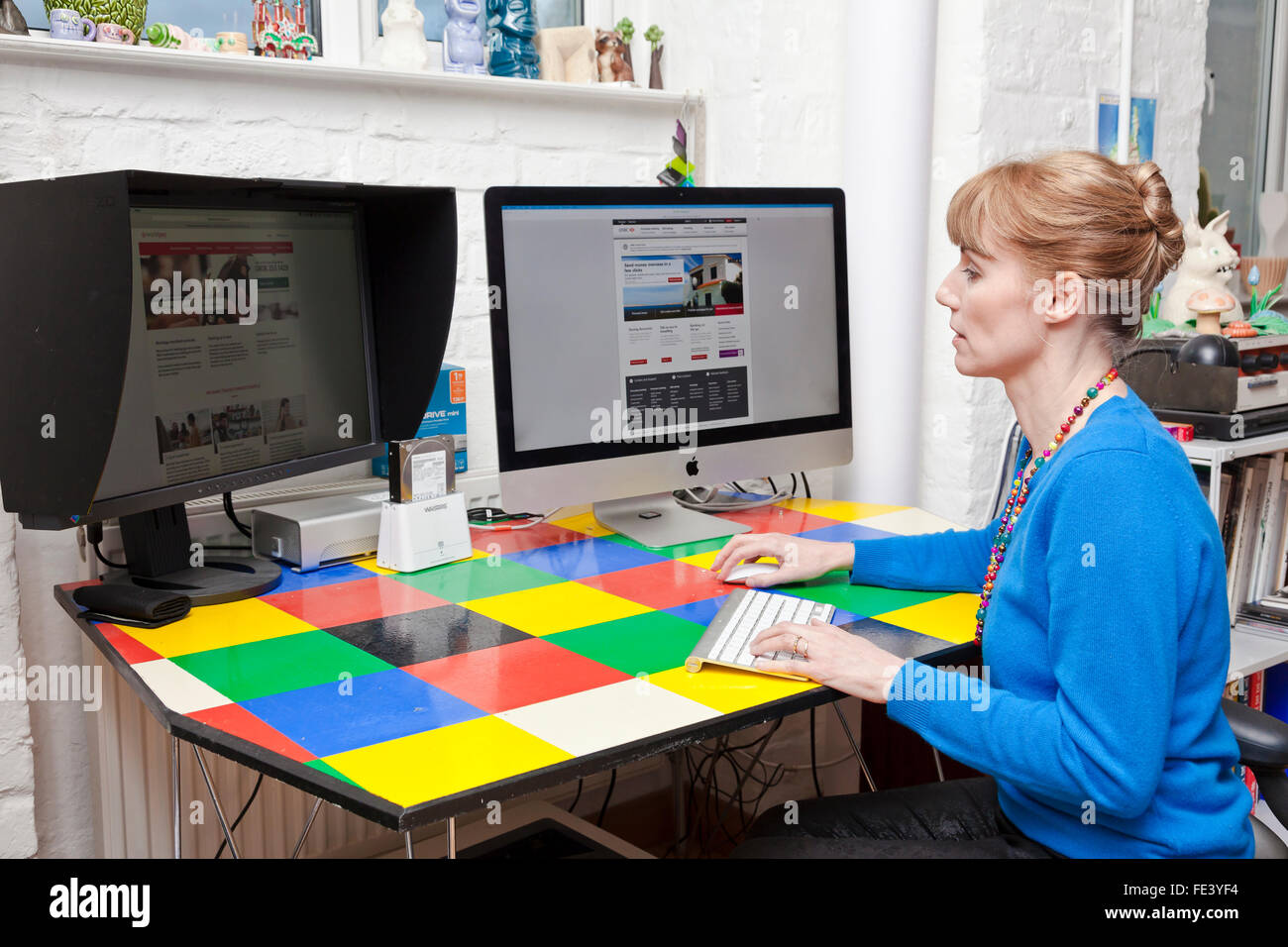 Woman checks her Internet bank account on a computer Stock Photo - Alamy