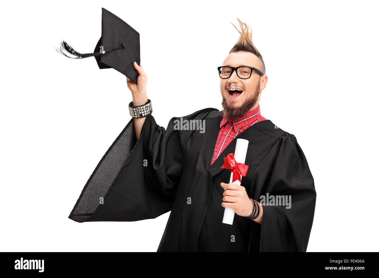Young man with a Mohawk hairstyle celebrating his graduation isolated ...