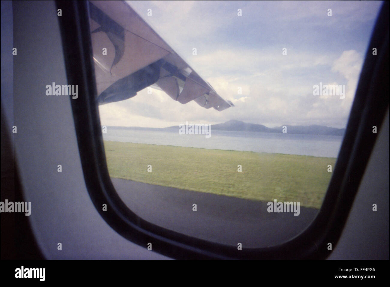 Calm Lake Seen Through Airplane Window Stock Photo - Alamy