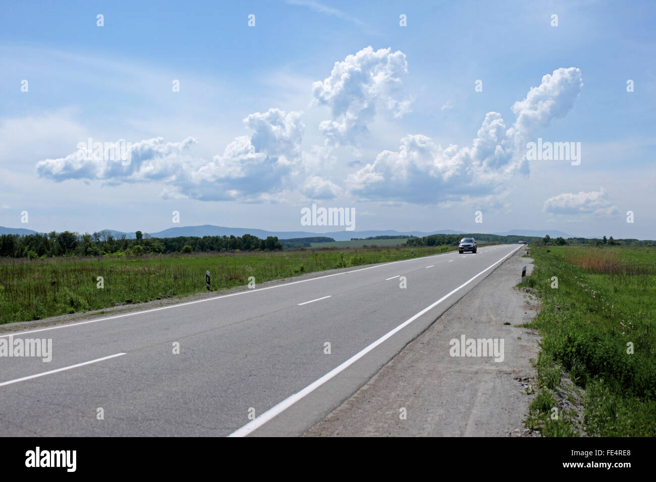 The road stretches into the distance Stock Photo - Alamy