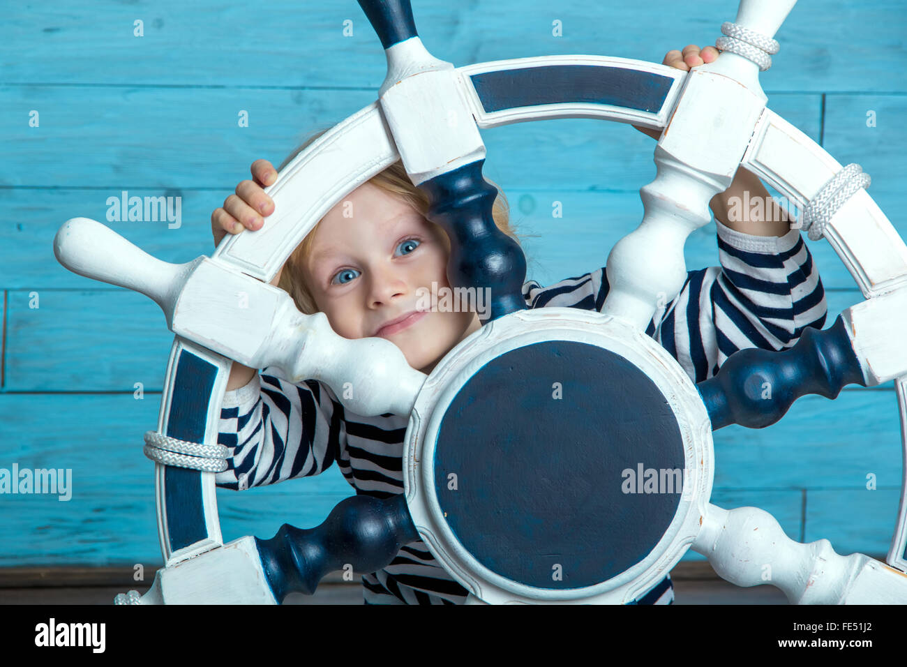 child looking through the wheel Stock Photo - Alamy