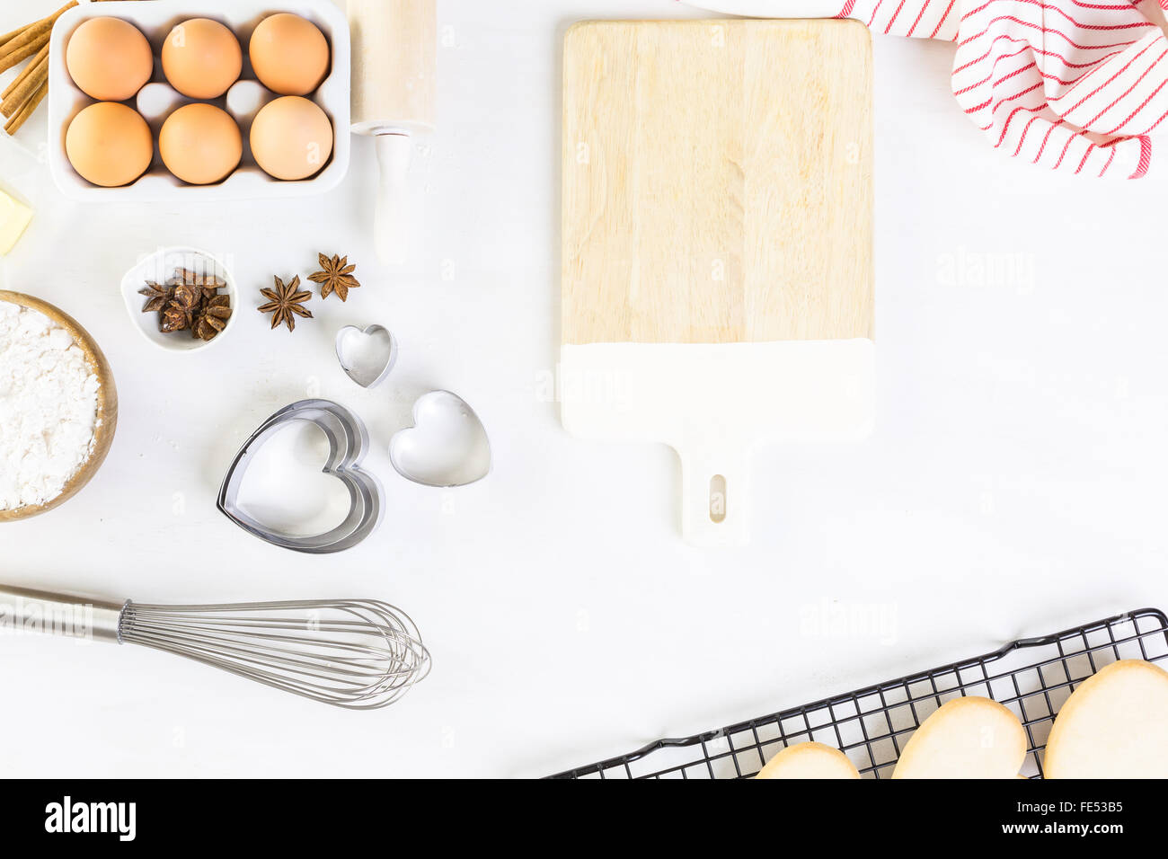 Baking heart shaped sugar cookies for Valentines Day Stock Photo - Alamy