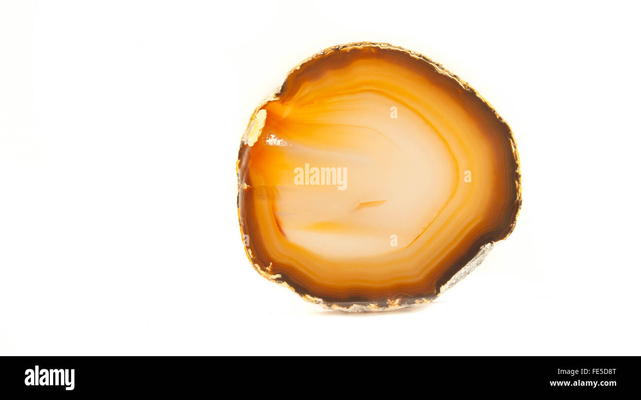 Section of a white and orange geode in white background Stock Photo - Alamy