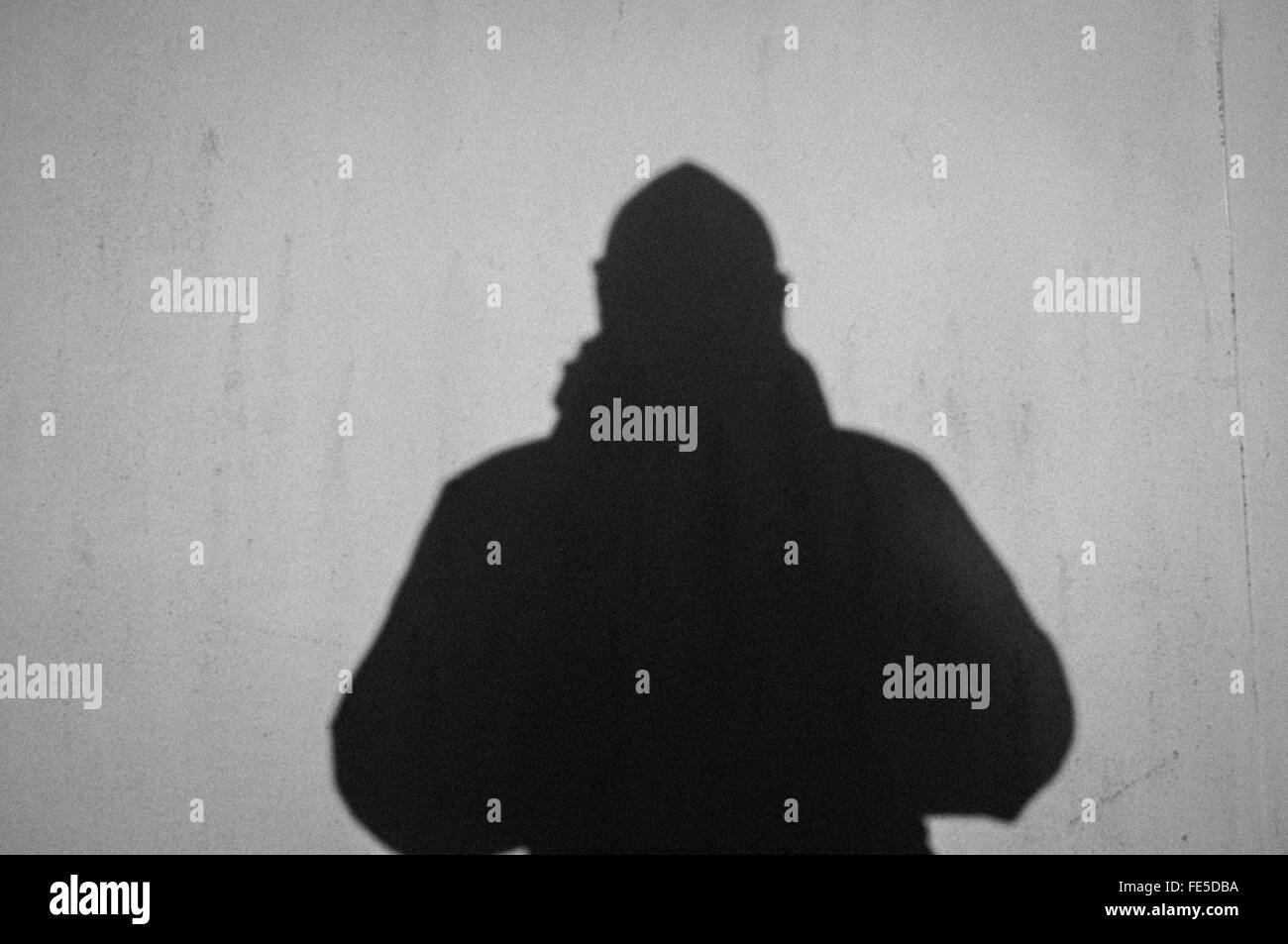 Man's Shadow On Wall Stock Photo - Alamy