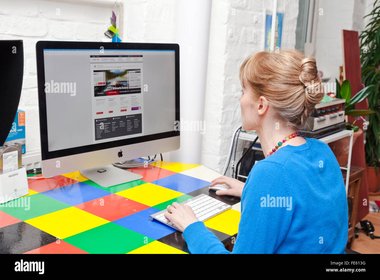 Woman checks her Internet bank account on a computer Stock Photo - Alamy