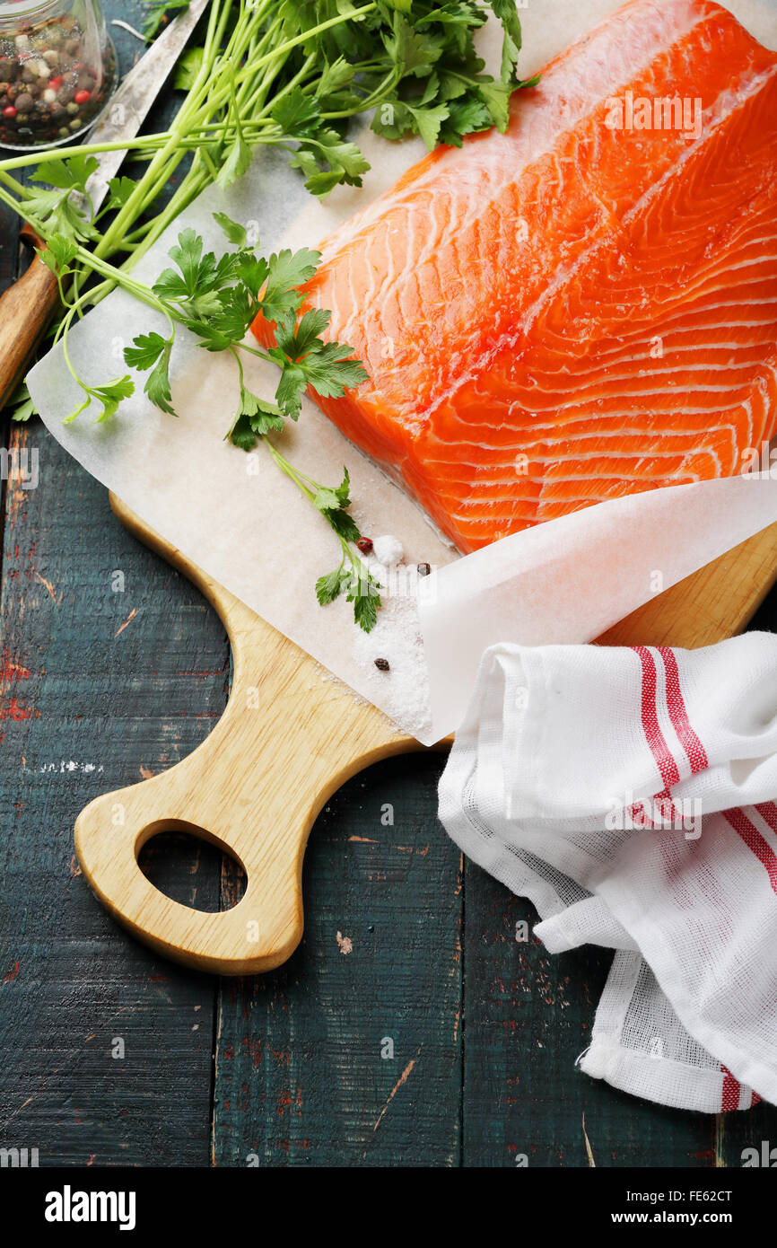 cutting fresh salmon fillet, cooking food Stock Photo - Alamy