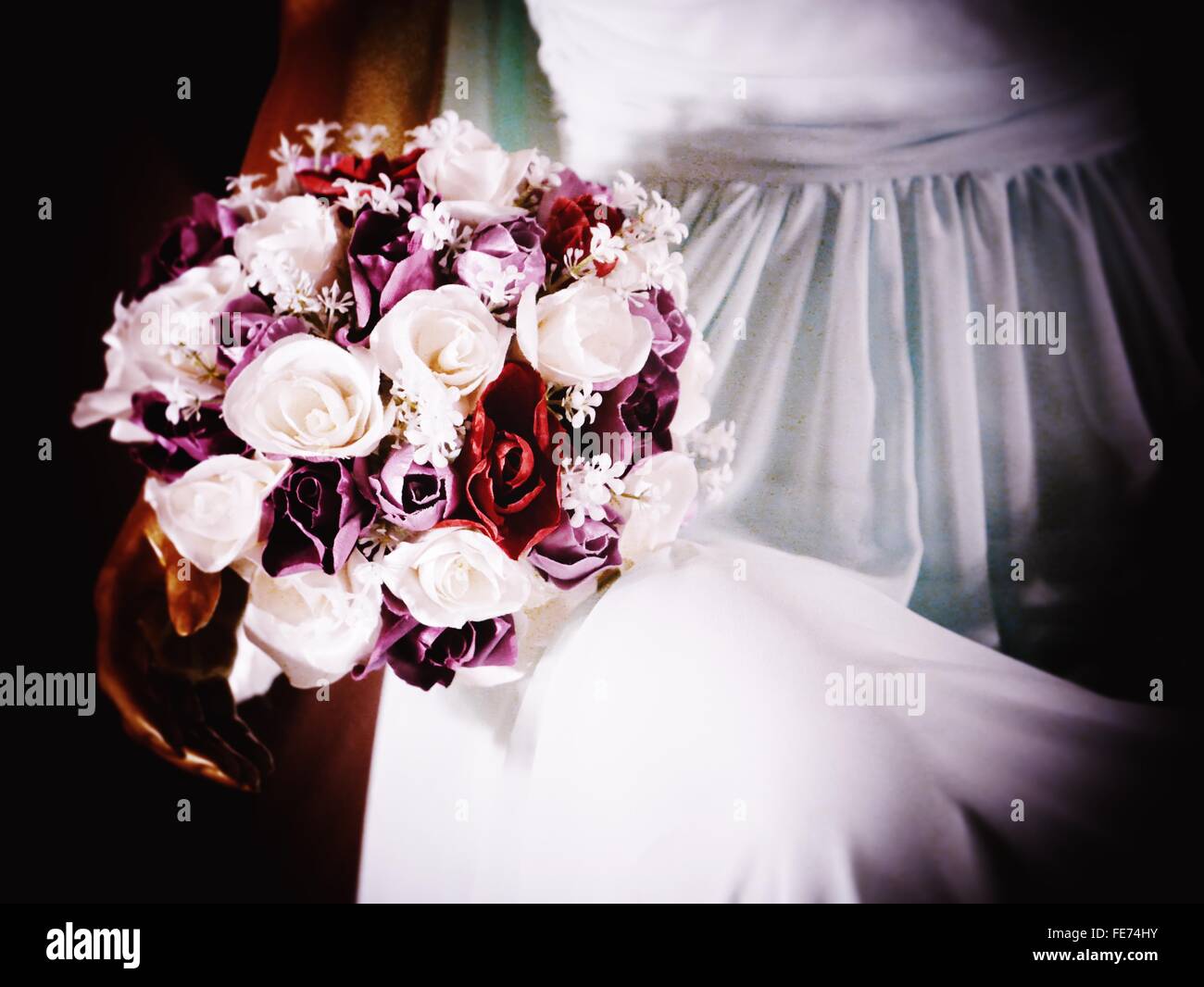 Statue Of Bride Holding Flowers Stock Photo - Alamy