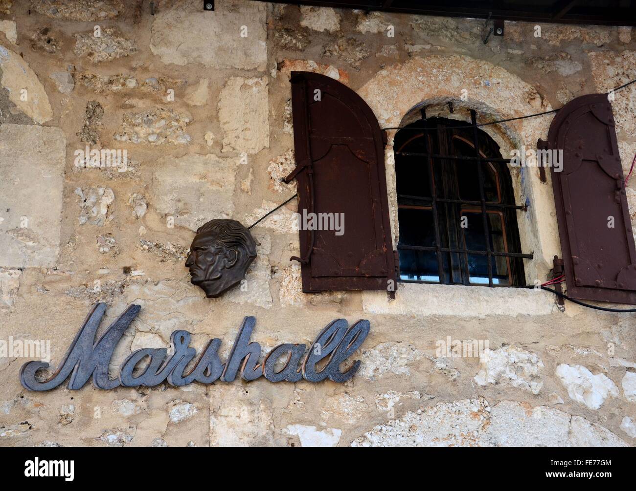 Medieval window and face bust of Yugoslav Marshall Tito Mostar Bosnia ...