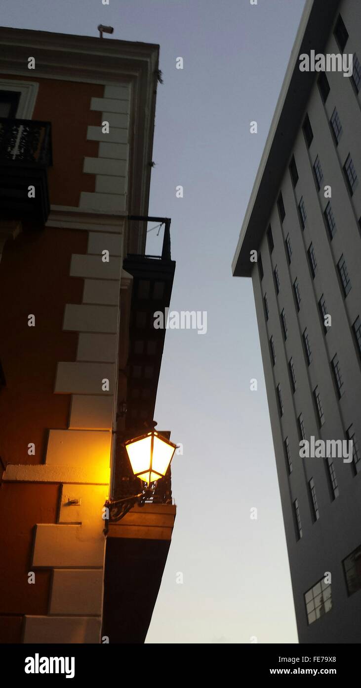 Illuminated Street Light On Building Stock Photo - Alamy