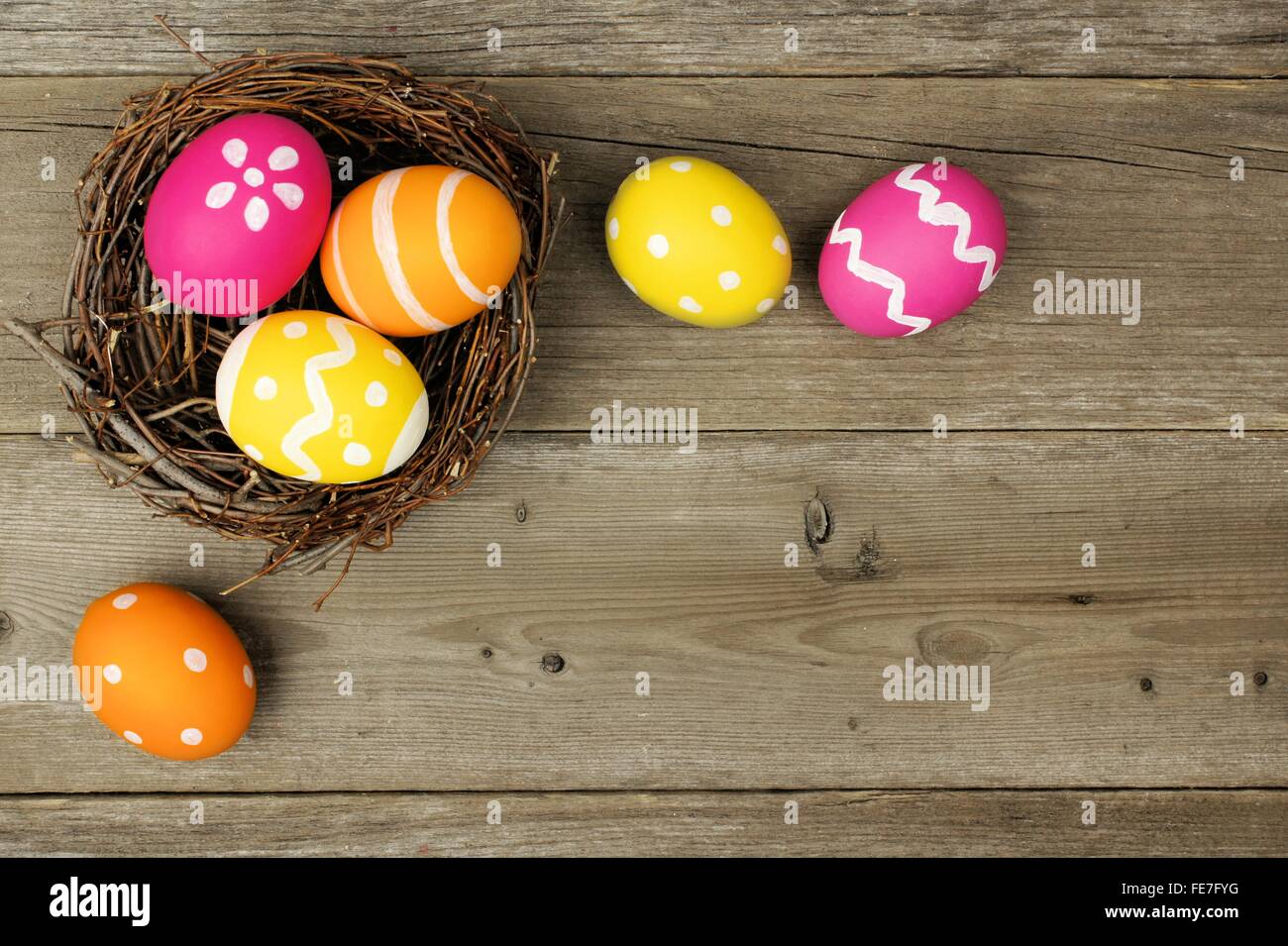 Easter egg border with nest over an old wood background Stock Photo - Alamy