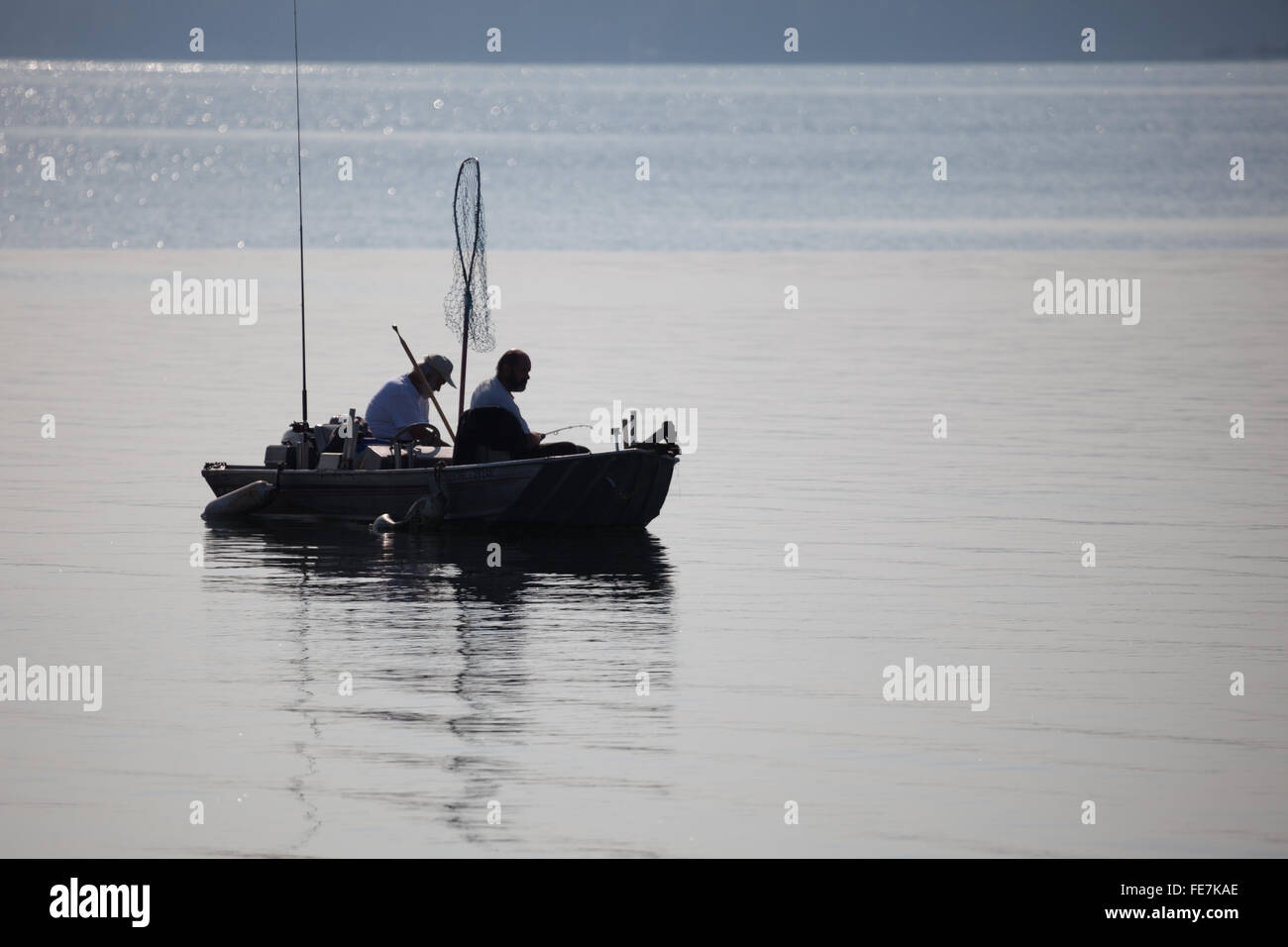 Two men fishing in a boat hi-res stock photography and images - Alamy