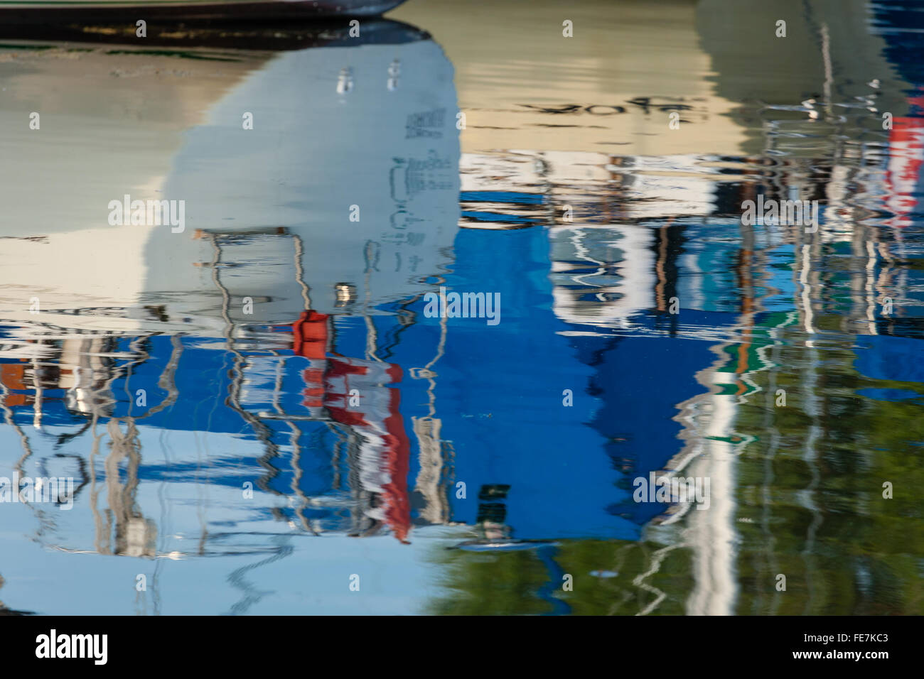 A reflection of boats mored in a marina Stock Photo - Alamy