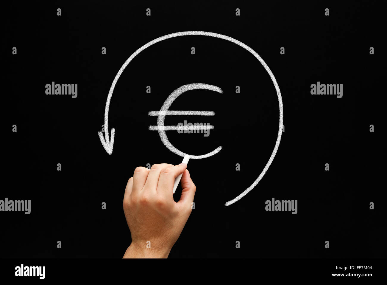 Hand sketching Euro sign in arrow circle with white chalk on blackboard ...