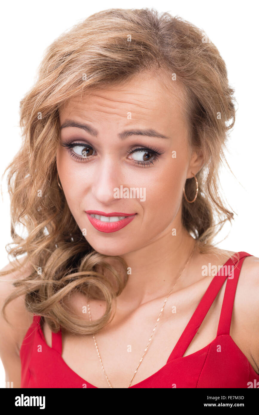young woman looks skeptical Stock Photo - Alamy