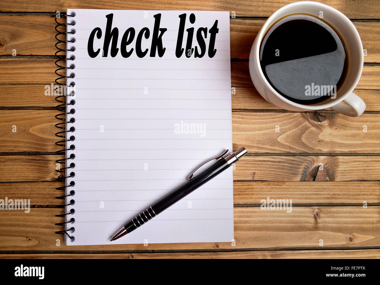 Check list word on notebook Stock Photo - Alamy