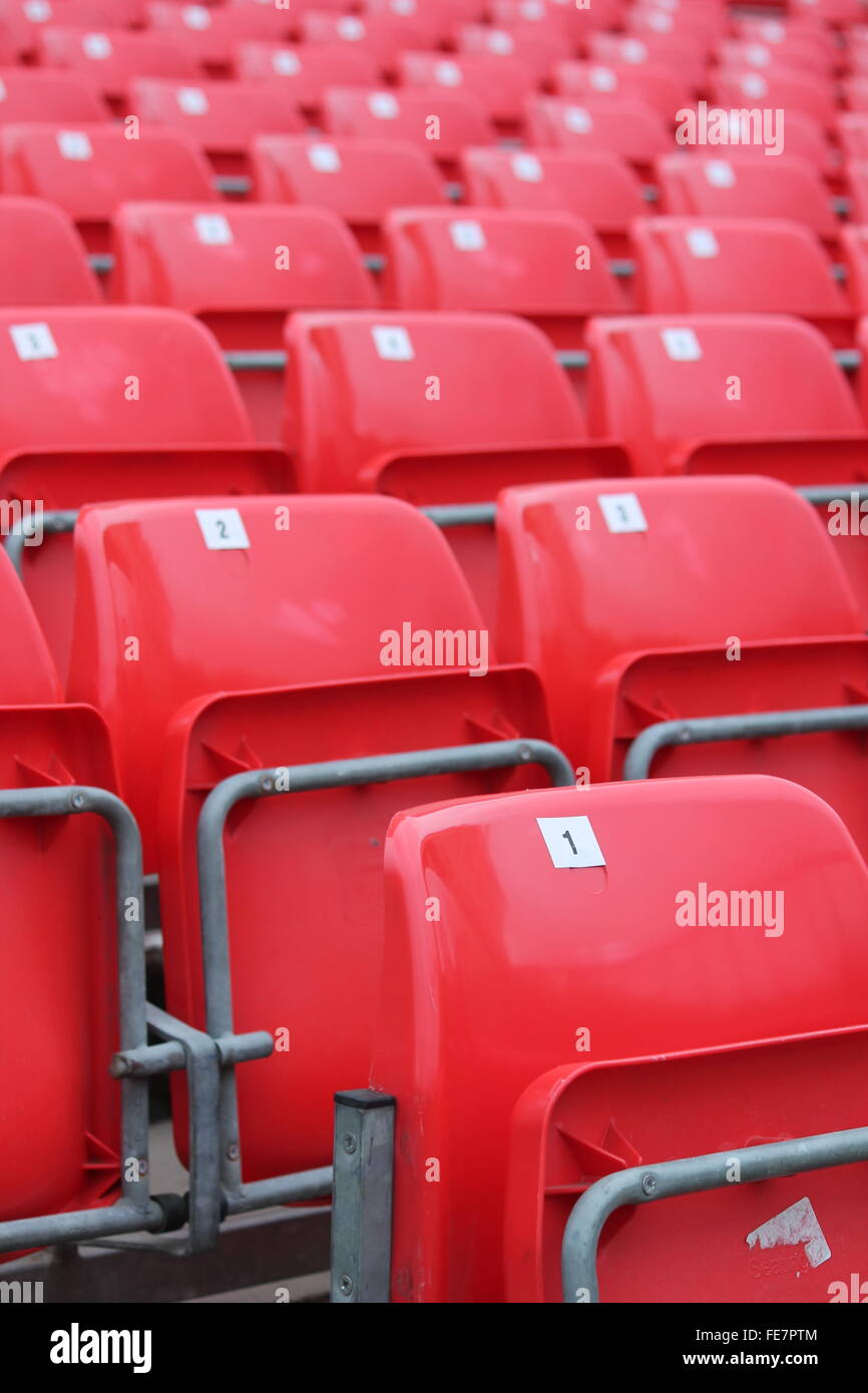 Many empty red plastic stadium seats folding temporary for street ...