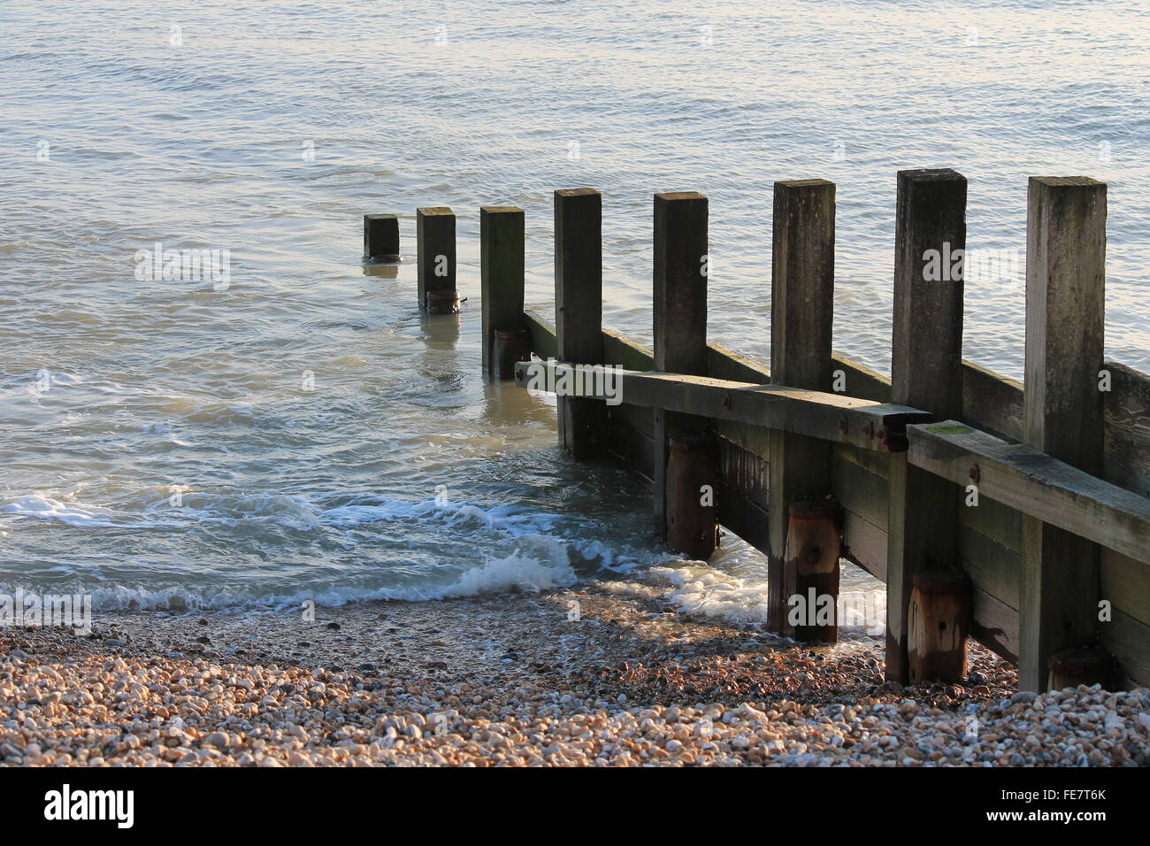 Old groin water breaker sea wall Stock Photo - Alamy