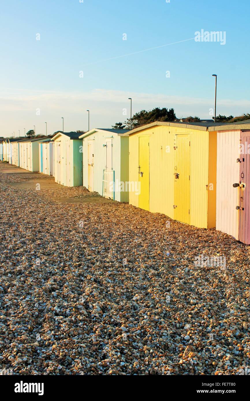 Traditional British beach huts at Uk seaside Brightly coloured beach ...