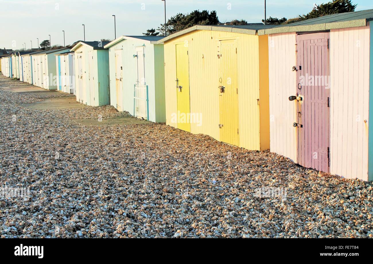 Traditional British beach huts at Uk seaside Brightly coloured beach ...