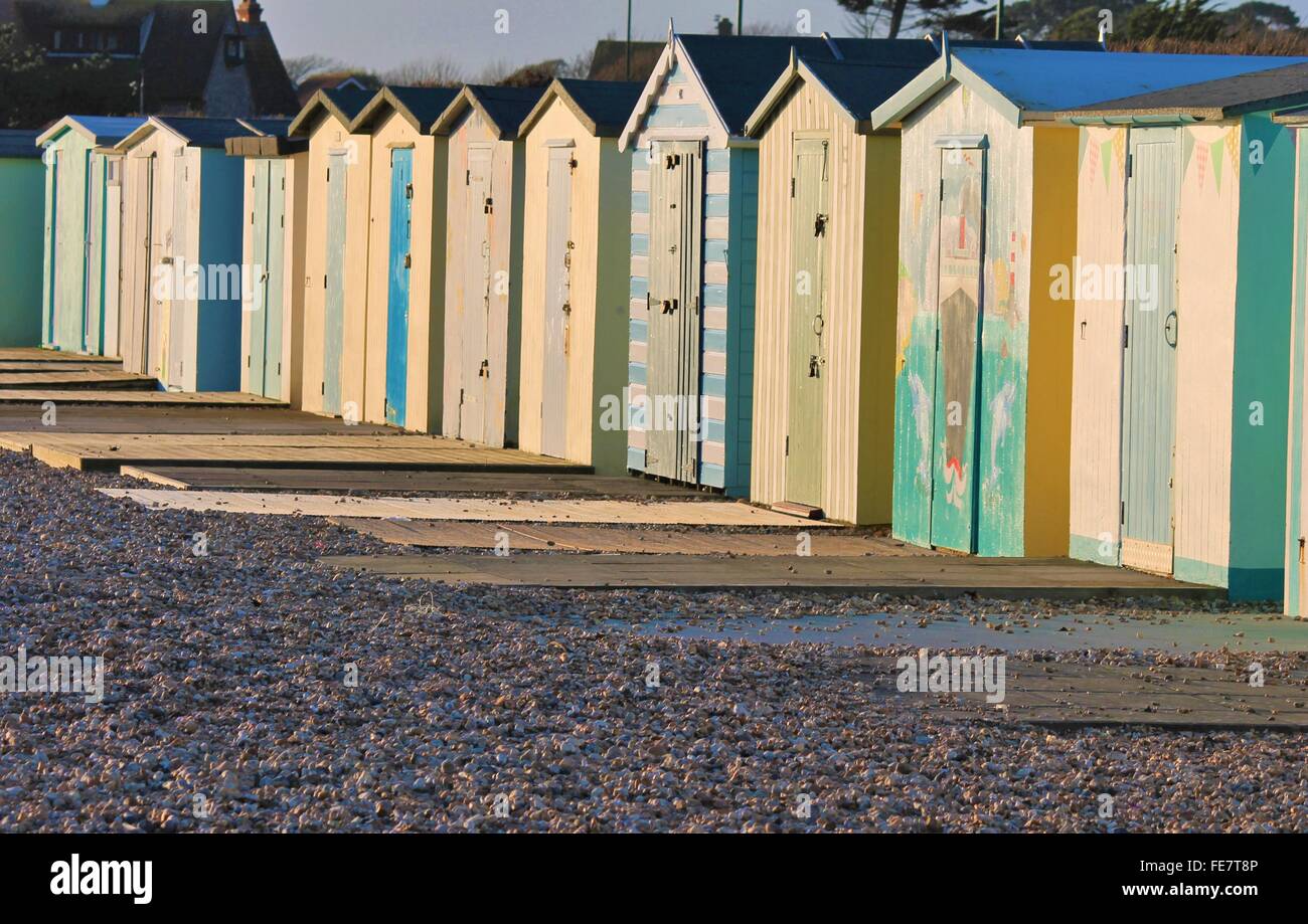 Traditional British beach huts at Uk seaside Brightly coloured beach ...