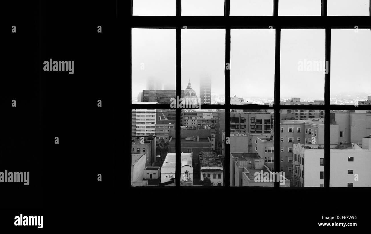 Buildings through window architecture Black and White Stock Photos ...