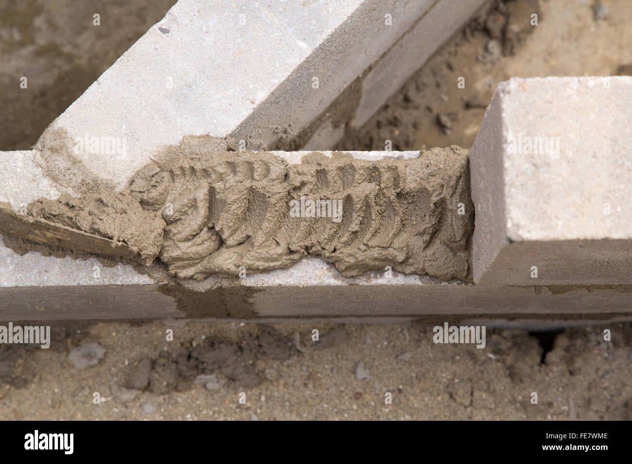Yellow spirit level on a constructed wall outdoors Stock Photo - Alamy