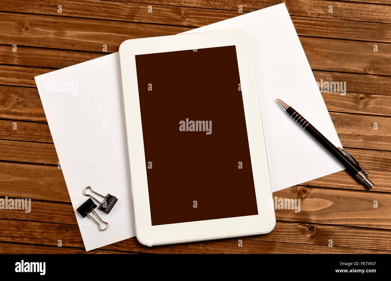 Digital tablet on wooden desktop hi-res stock photography and images ...