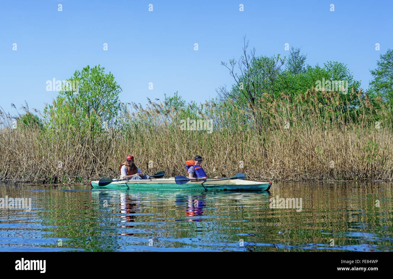 Spring river travel of school students group on canoes - may 2011 Stock ...