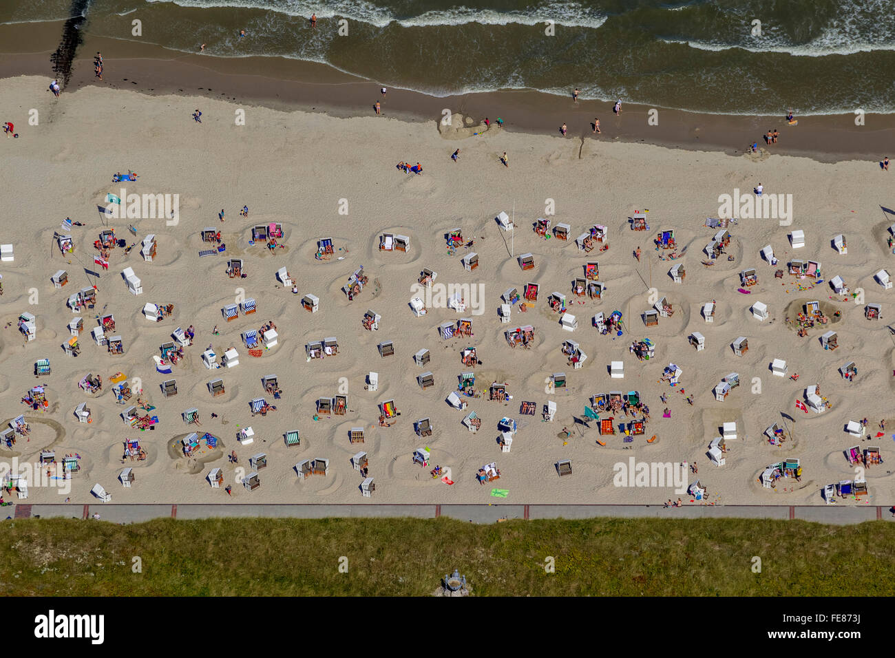 Aerial view, sandy beach with beach chairs and sand embankments ...