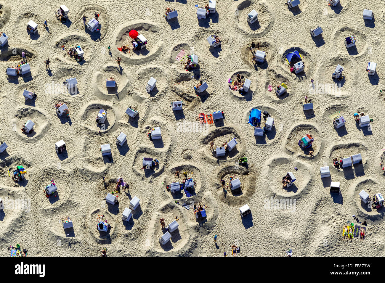 Aerial view, sandy beach with beach chairs and sand embankments ...
