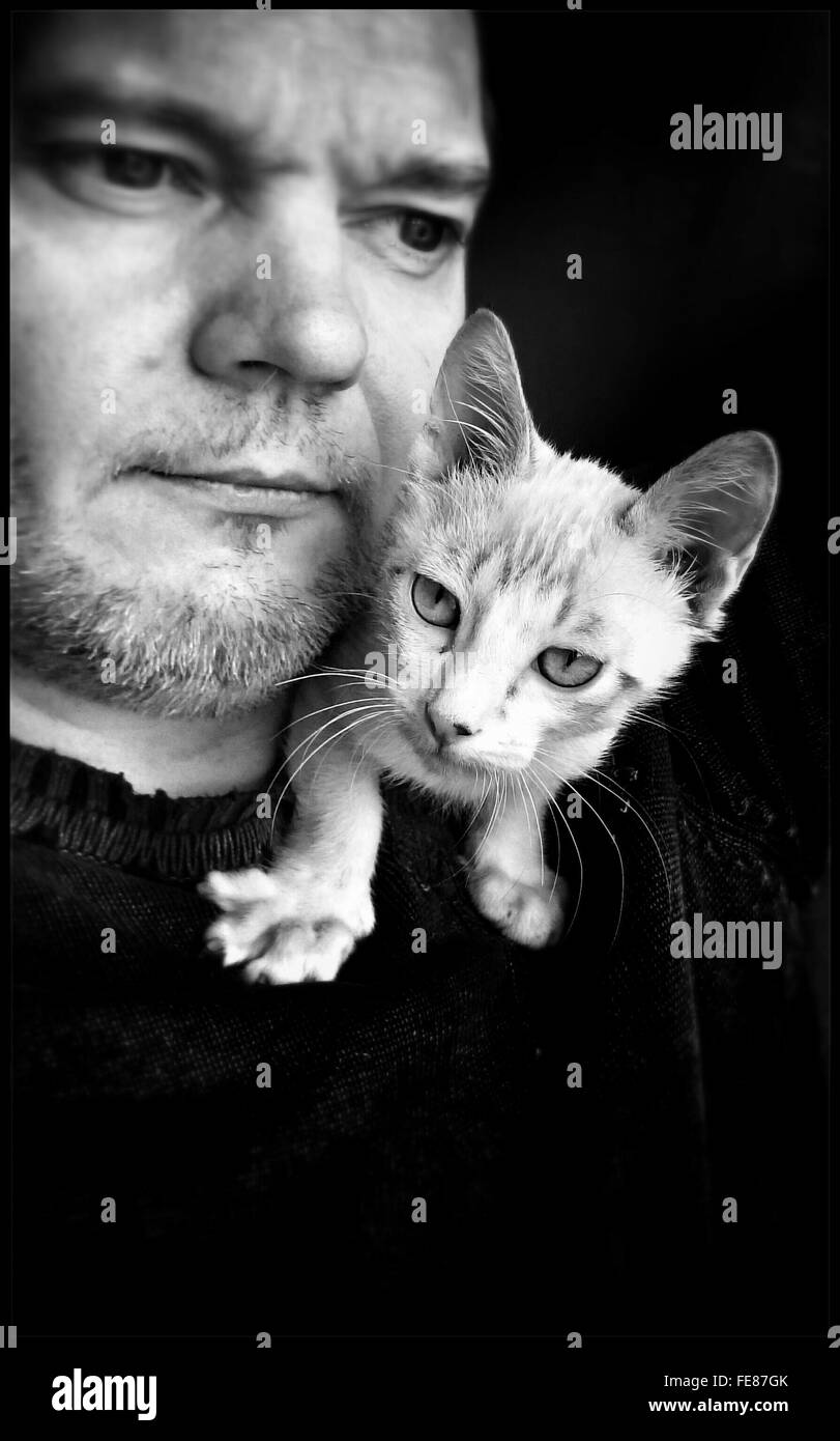 Man cat on shoulder hi-res stock photography and images - Alamy