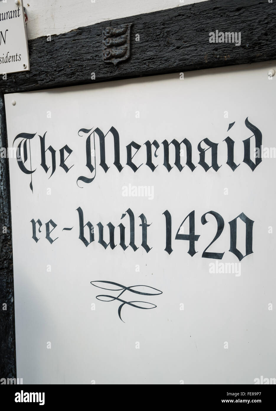 Sign painted on the building of The Mermaid Inn in Rye, East Sussex, UK ...