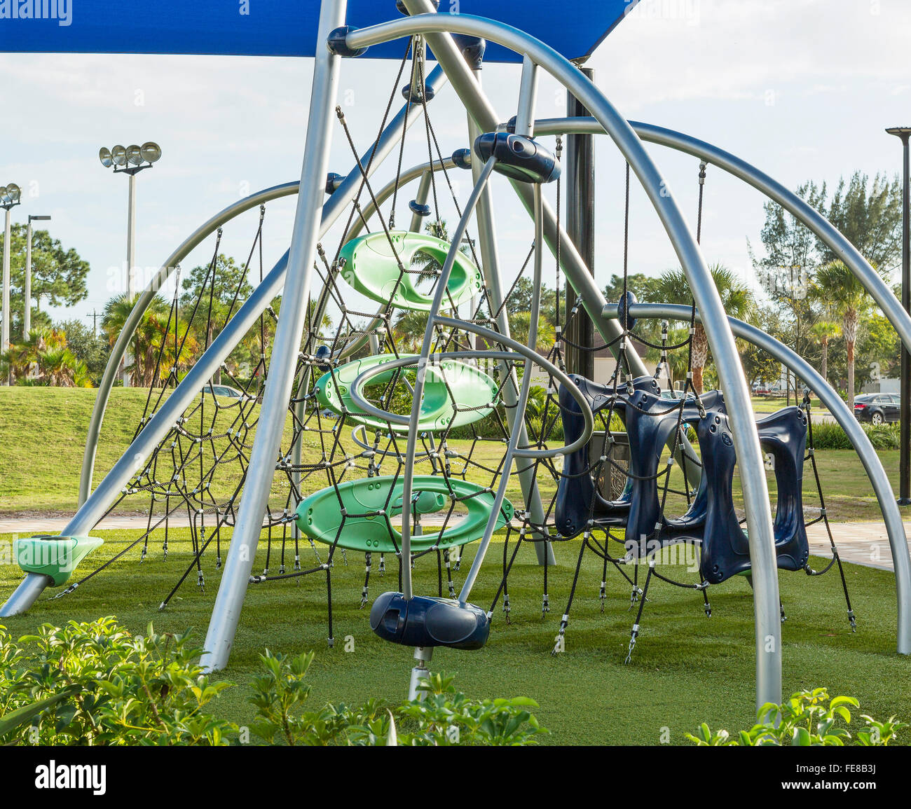 playground with slides and climbing frame in park Stock Photo - Alamy