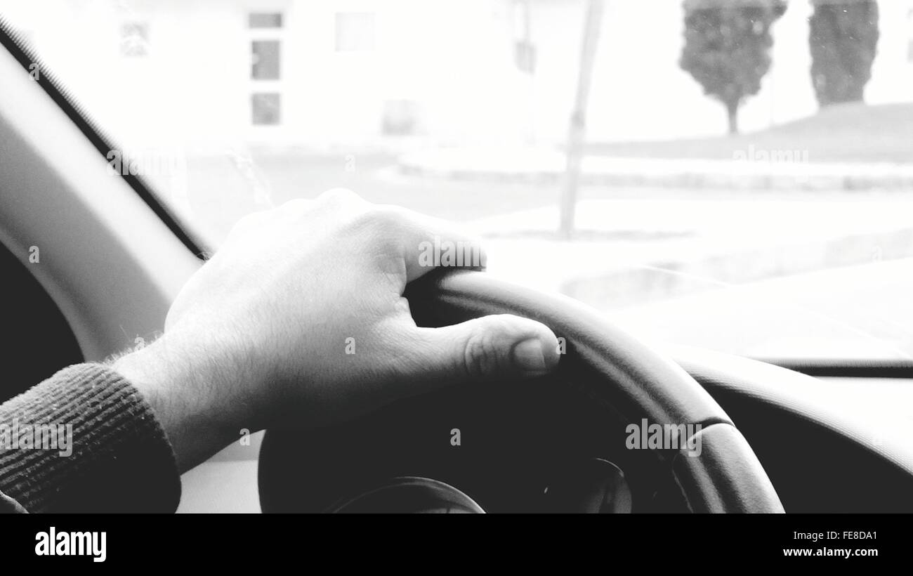 Mans hand steering wheel hi-res stock photography and images - Alamy