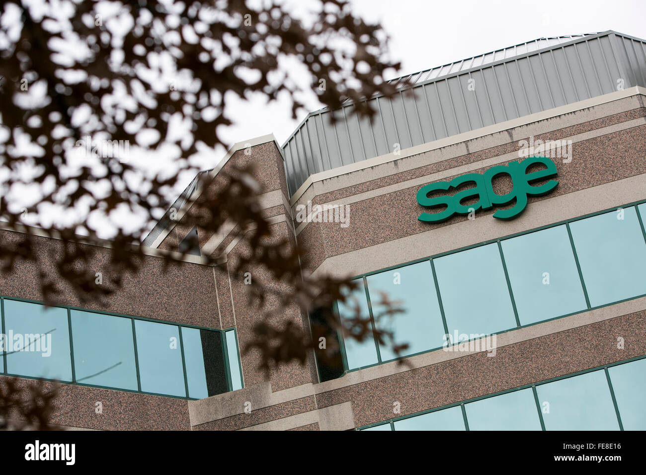 A logo sign outside of an office building occupied by The Sage Group in ...