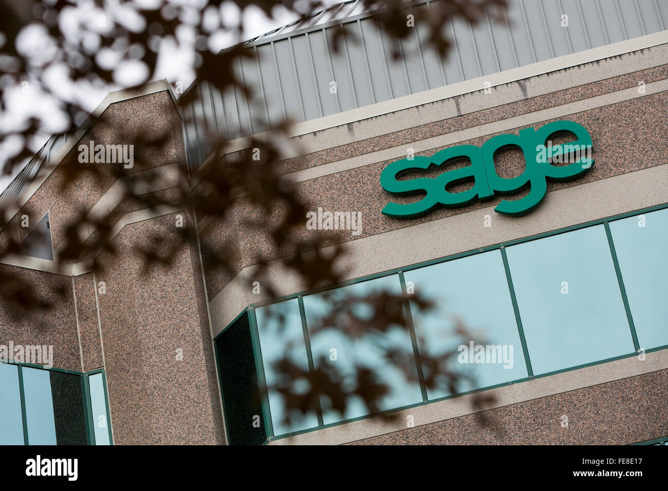 A logo sign outside of an office building occupied by The Sage Group in ...