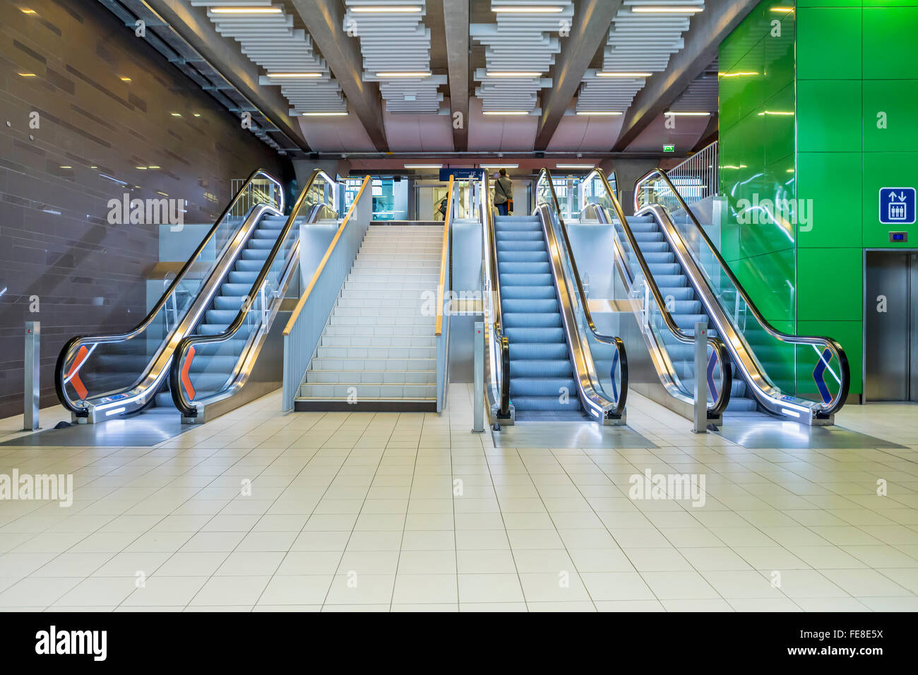 Botton view of 3 escalators, green color combination. panoramic angle ...
